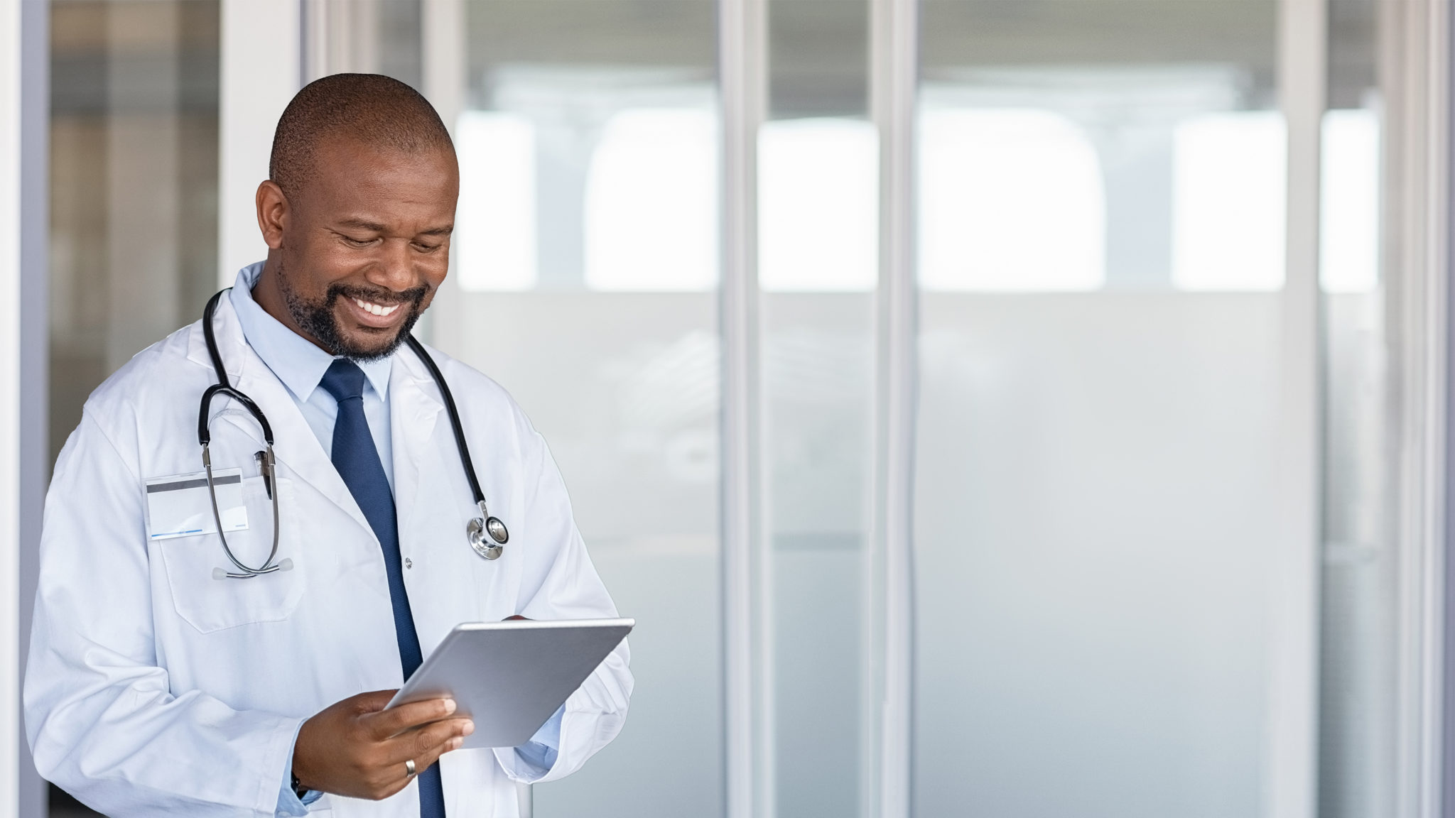 African doctor using digital tablet at hospital – Navitas